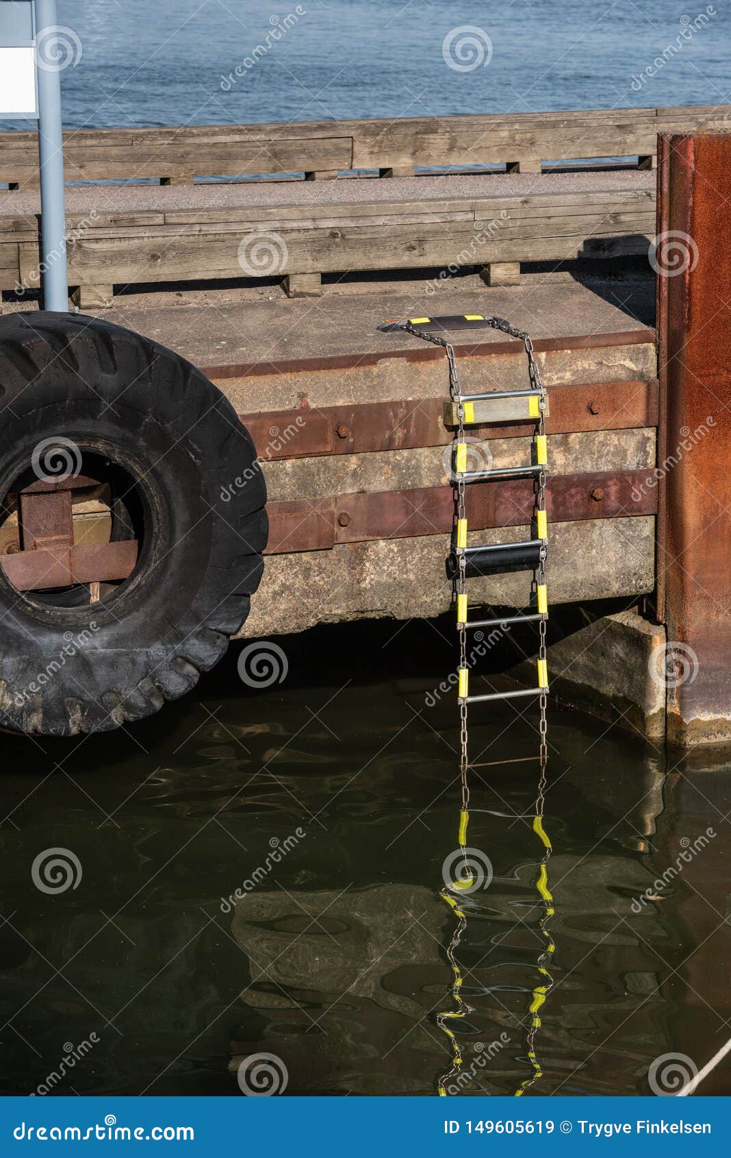 Tyre and Rescue Ladder on a Pier by the River Stock Image - Image of ...