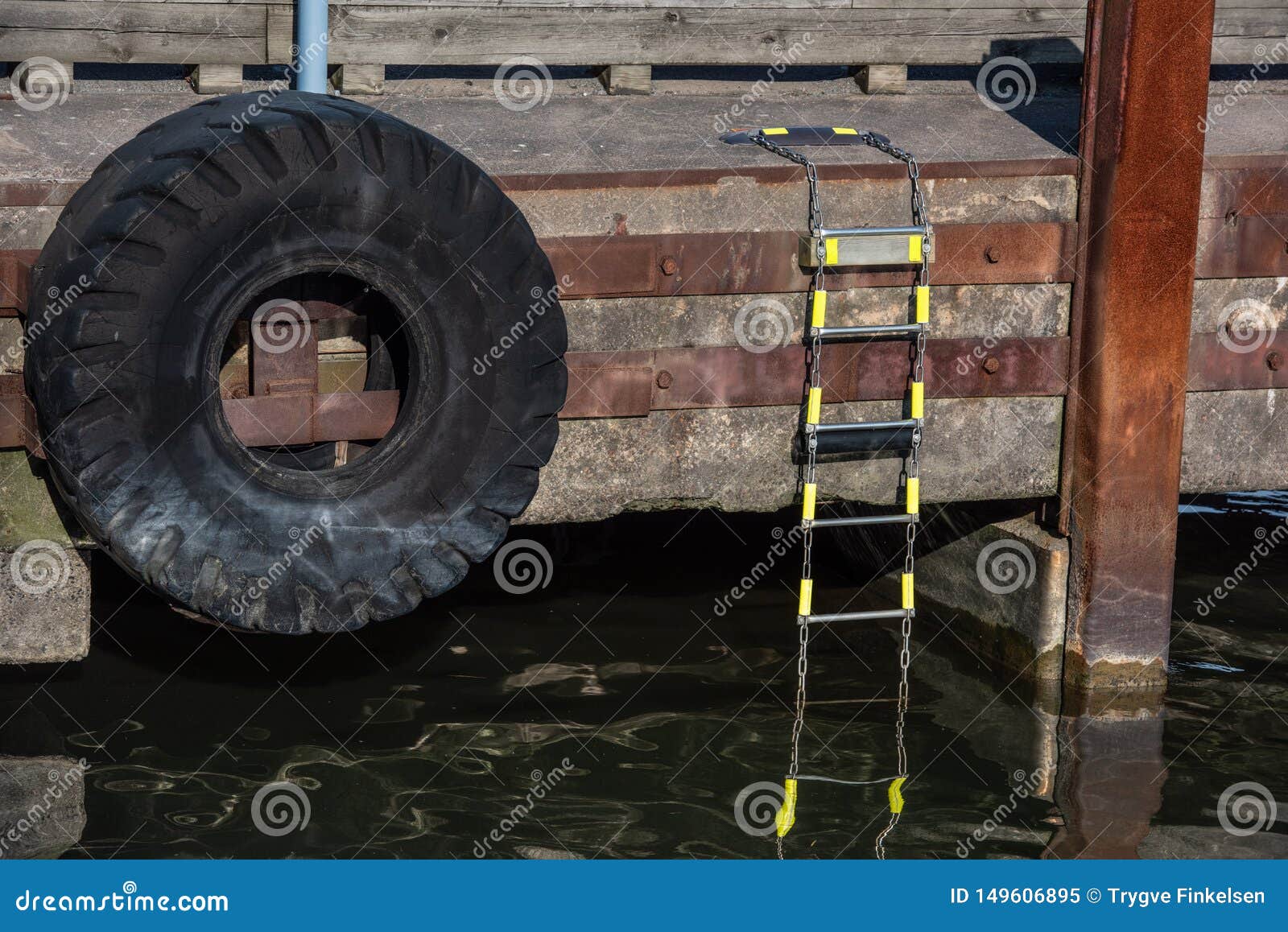 Tyre and Rescue Ladder on a Pier by the River Stock Image - Image of ...