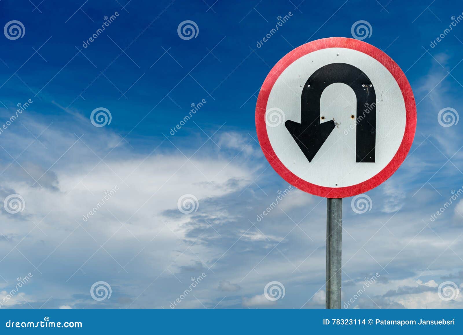 U Turn Sign on White Cloud and Blue Sky Background Stock Photo - Image ...