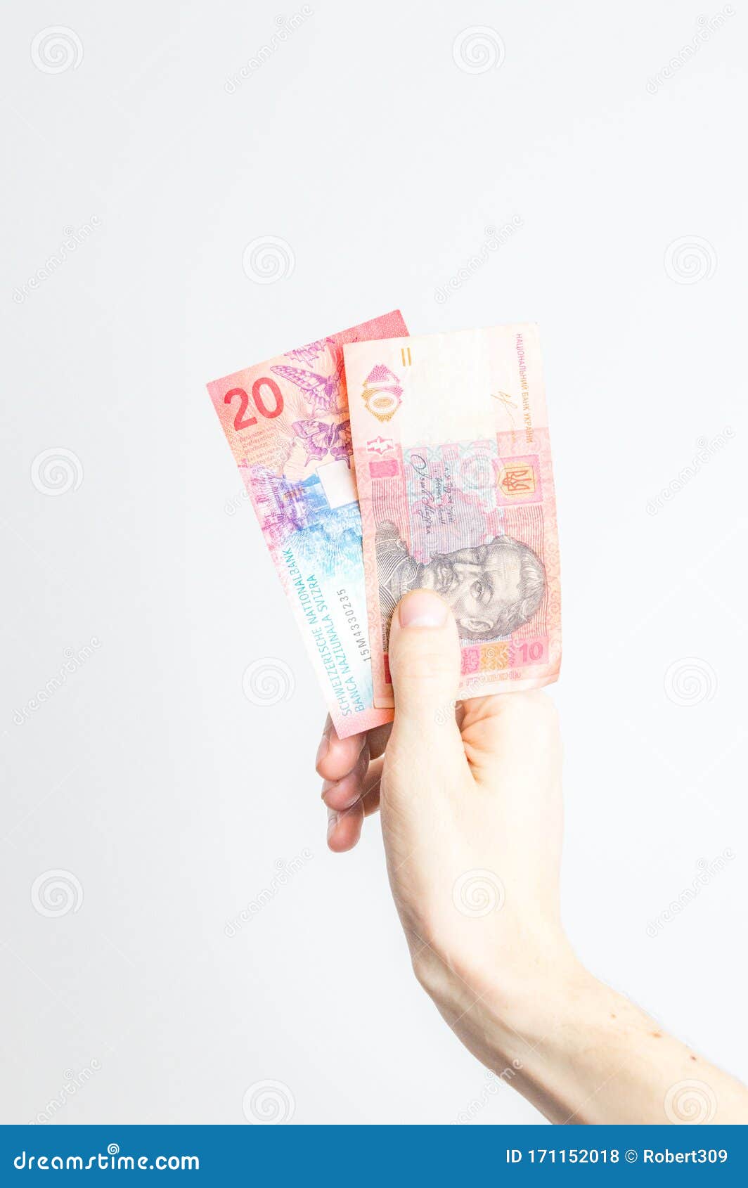 10 UAH and 20 CHF Banknotes Held in Hand Stock Photo - Image of credit ...