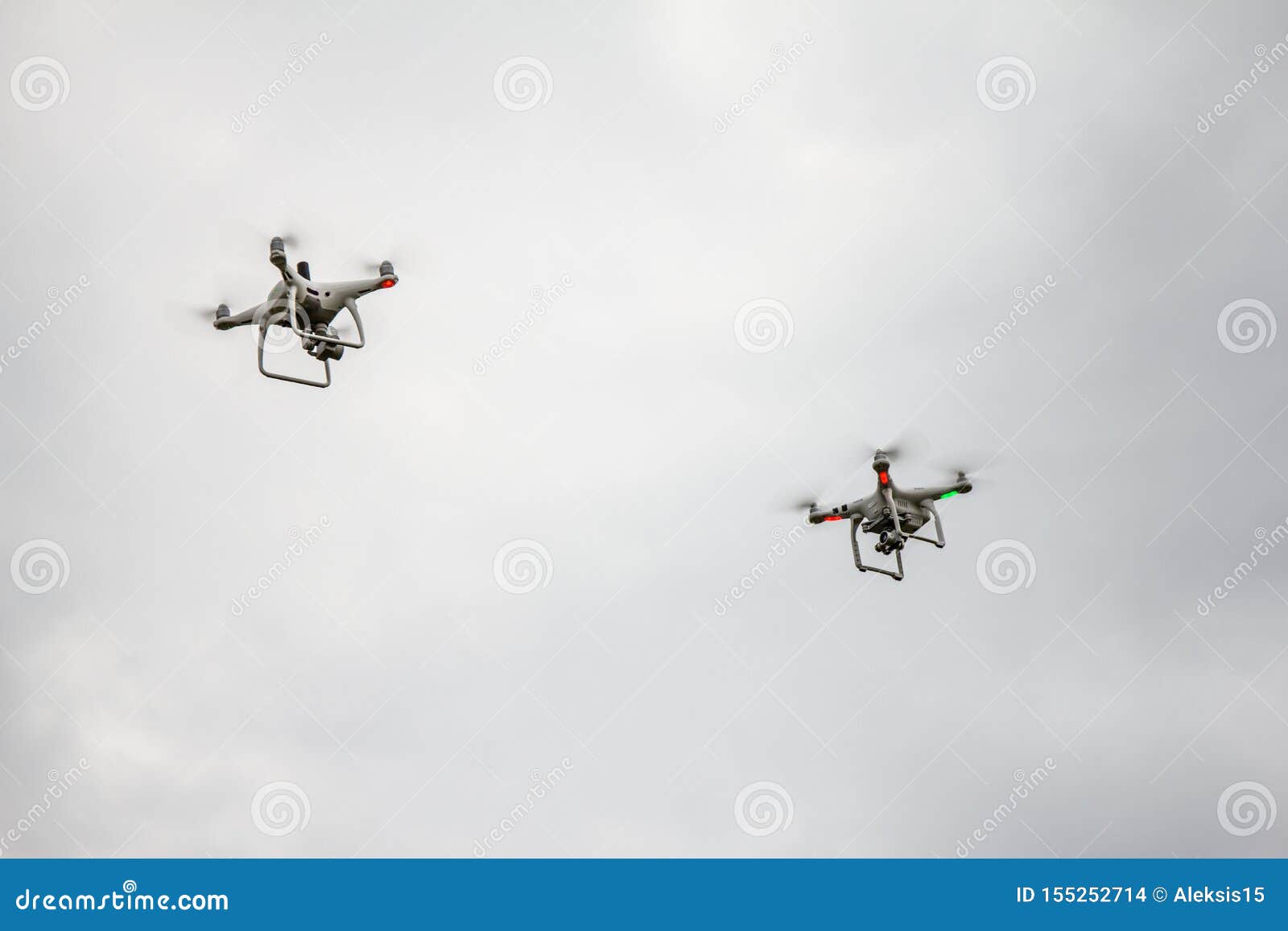 UAV Two White Drones Quadr Copter in Flight with and Digital Camera ...