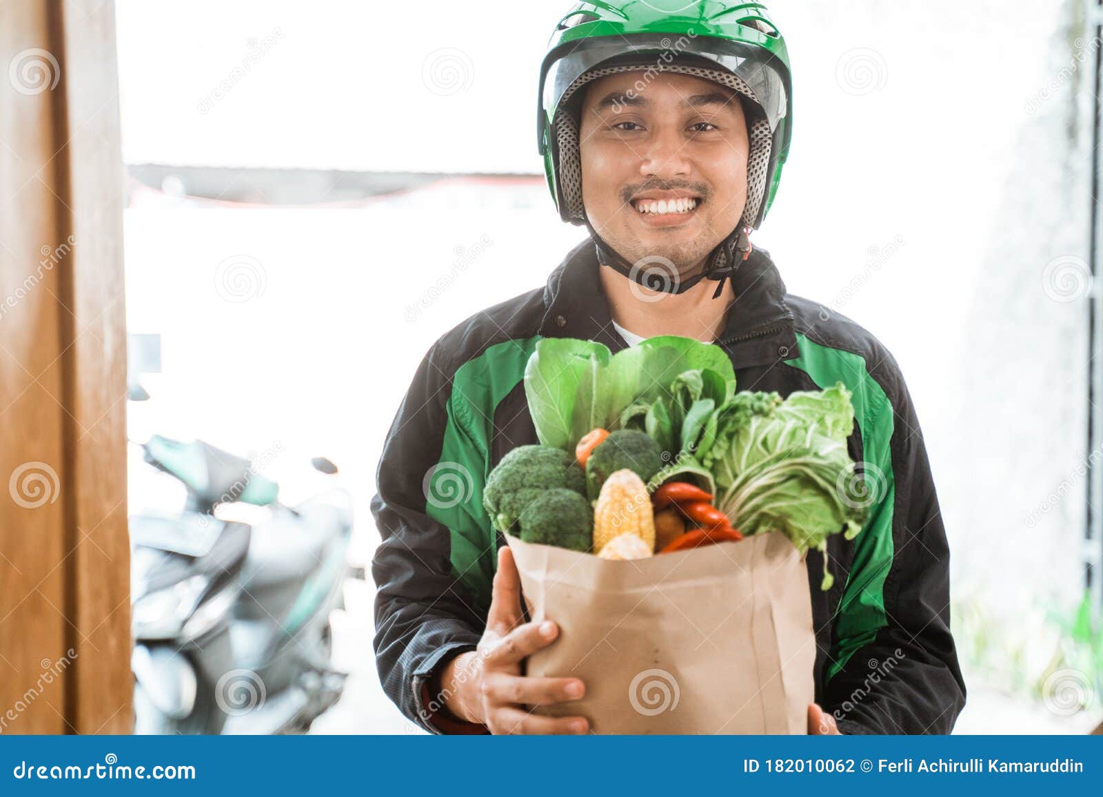 Uber Delivery Courier Looking at Camera Stock Photo - Image of asian ...