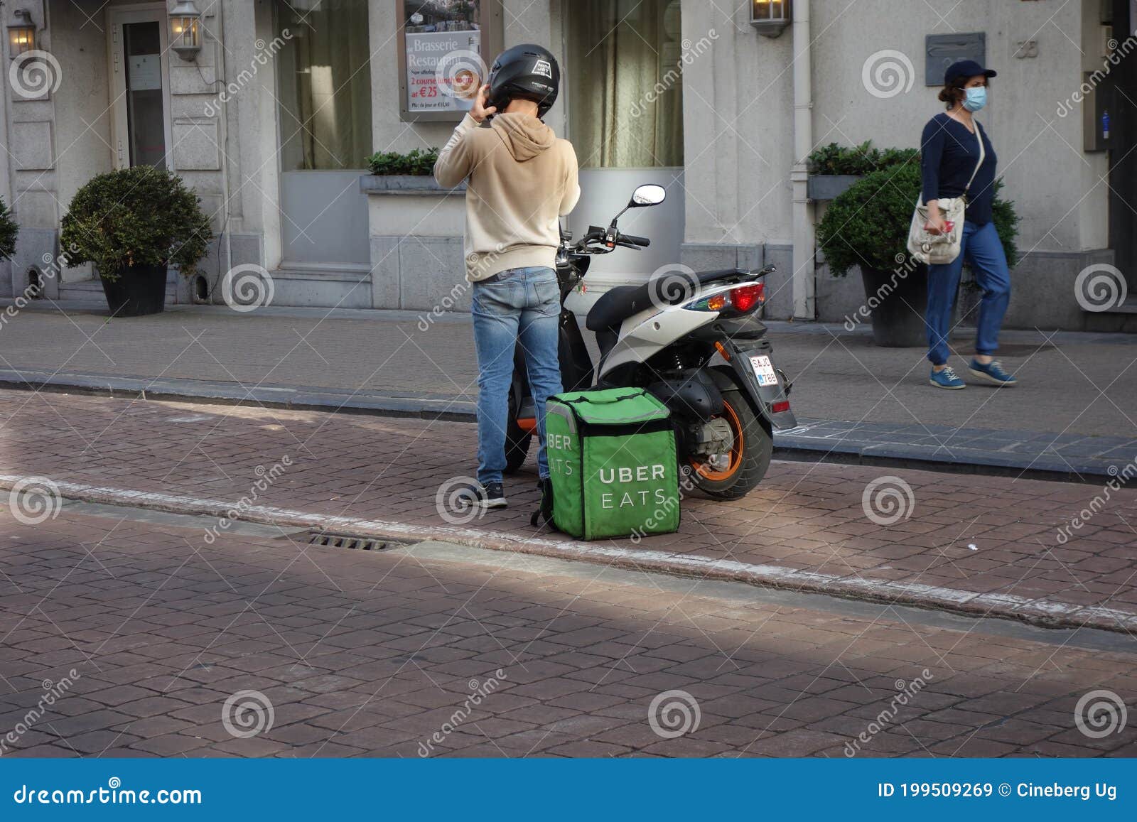 Uber Eats delivery man editorial stock image. Image of carrier - 199509269