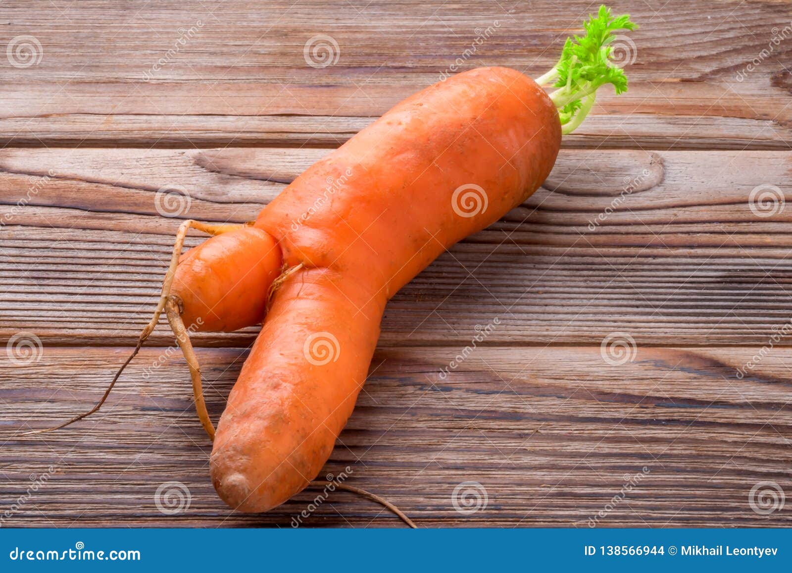Ugly Vegetable with Double Carrot on Wooden Background Stock Photo ...