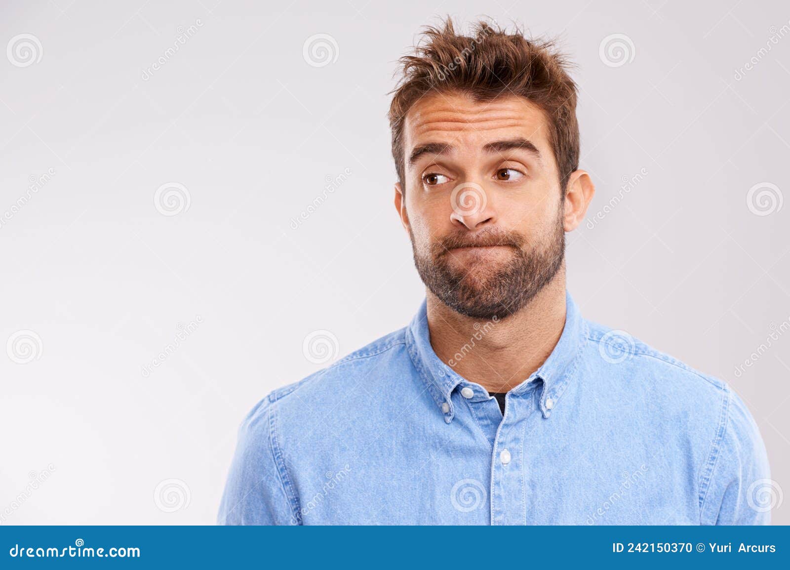 Uhhhmm.... a Studio Shot of a Handsome Man Making a Face. Stock Photo ...