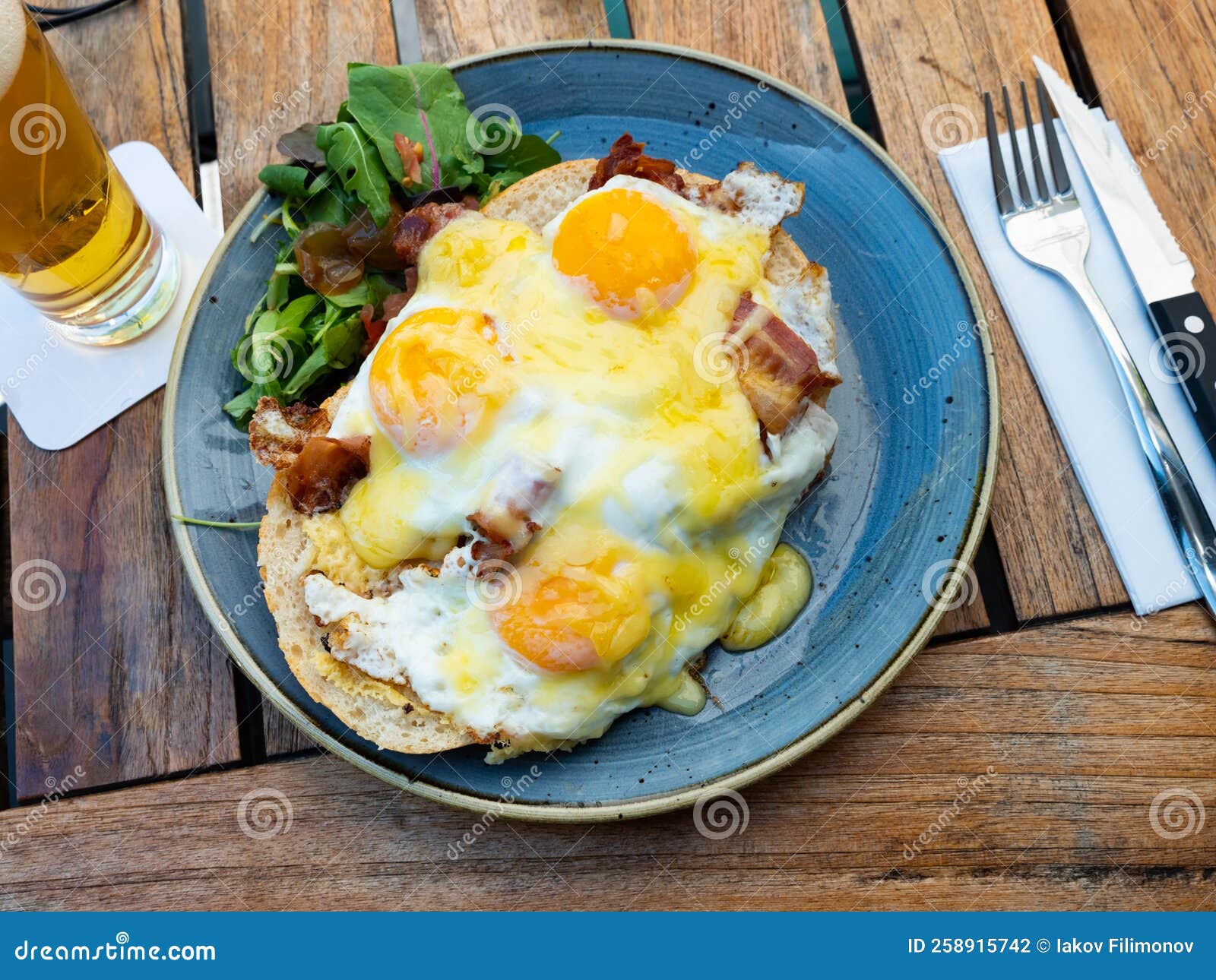 Uitsmijter. Netherlands Scrambled Eggs with Bacon and Herbs Stock Photo ...