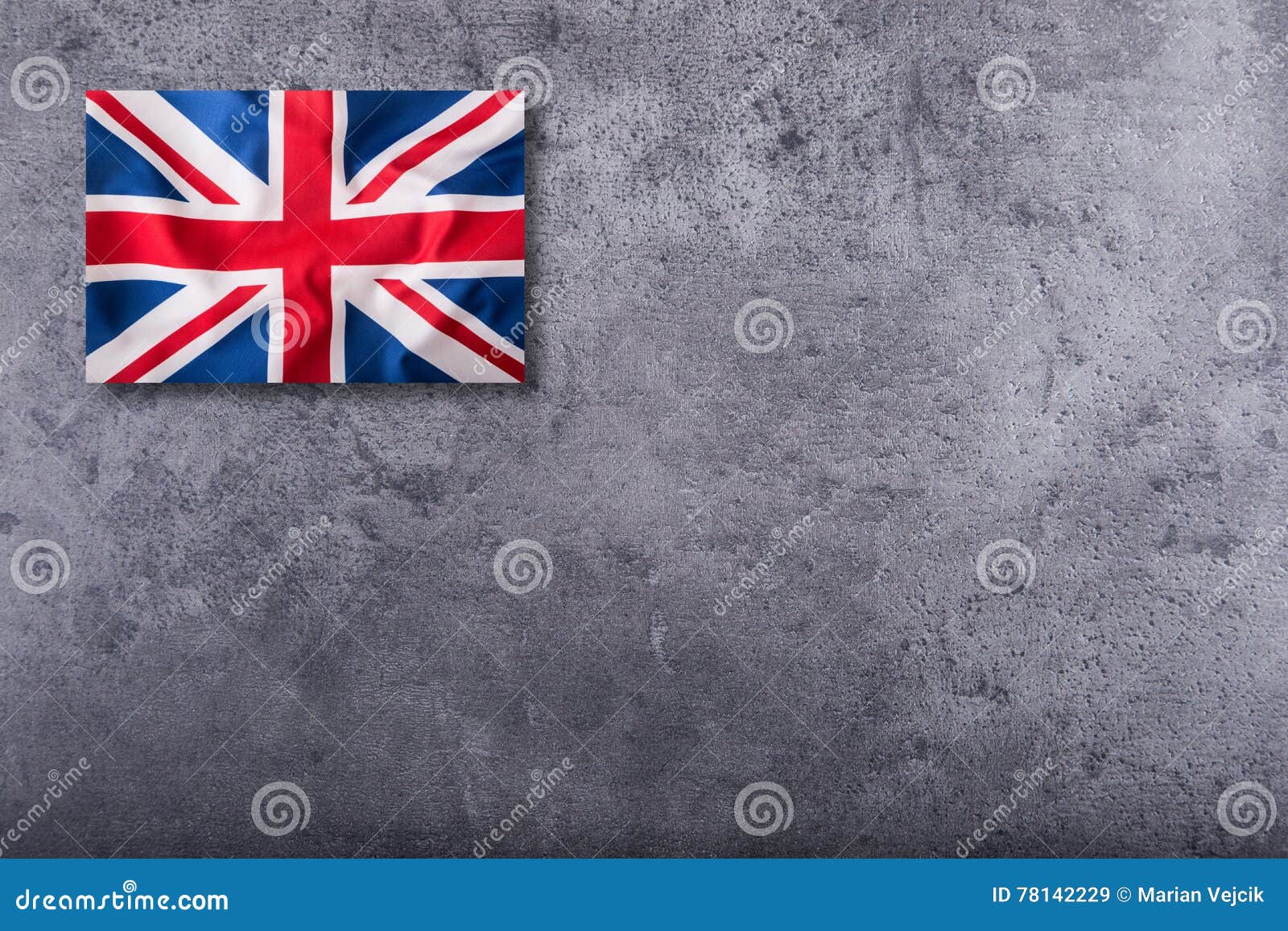 A British Union Jack Flag On A Pole With Black And White Buildings ...
