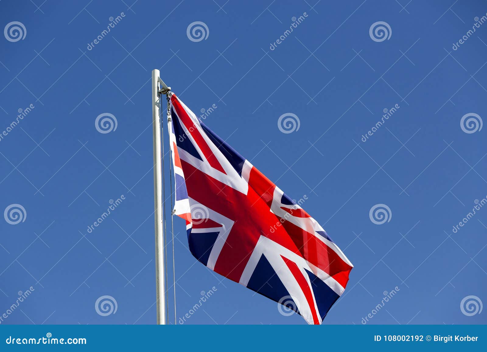 UK flag on a flagpole stock photo. Image of flagpole - 108002192