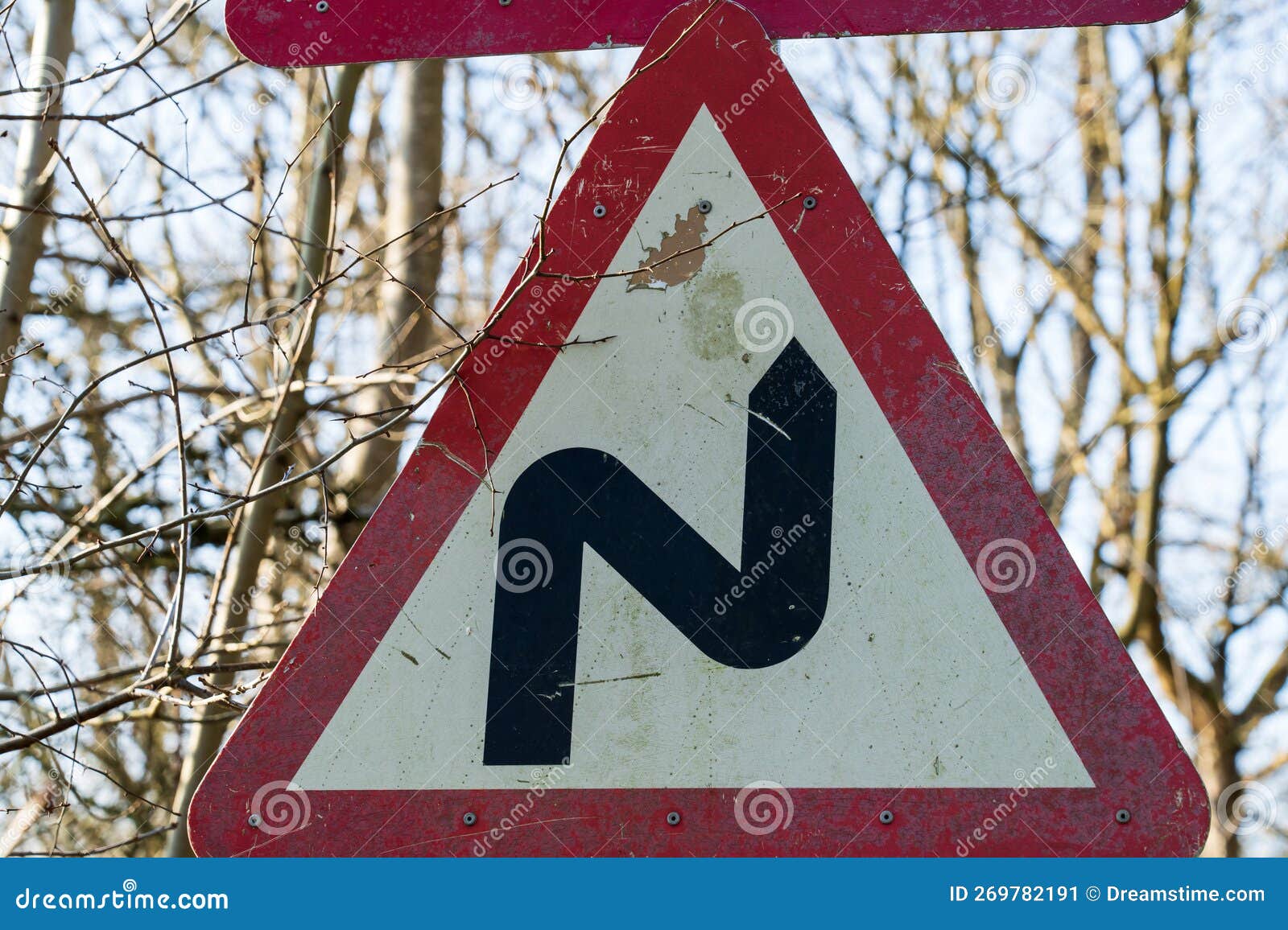 A UK Traffic Sign Stating Winding Road with a Read and White Warning ...