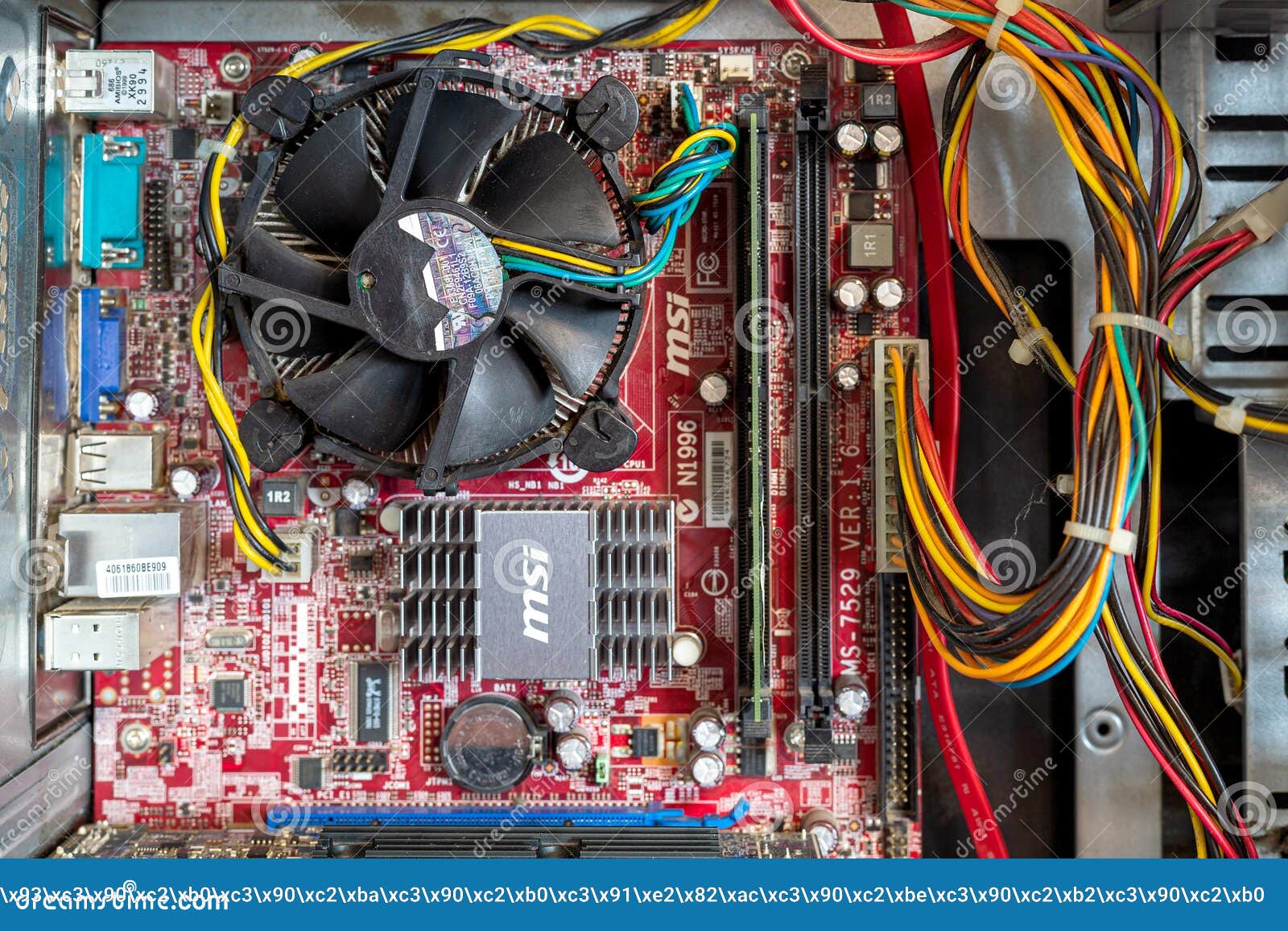 Ukraine - April 25, 2020: Computer Motherboard with CPU Coller Inside ... Ukraine - April 25, 2020: Computer Motherboard with CPU Coller Inside ...