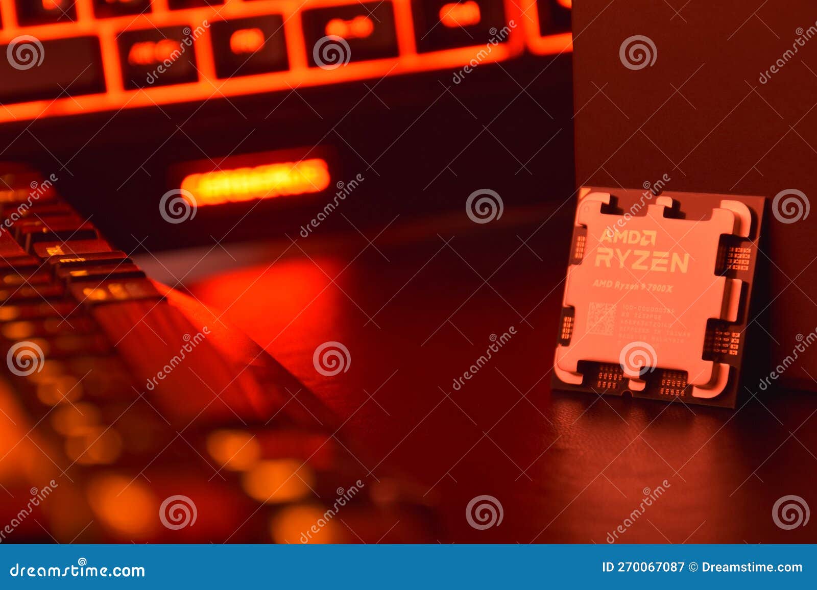 A Close-up of an AMD Ryzen 9 7900X Processor in a Packaging Box with ...