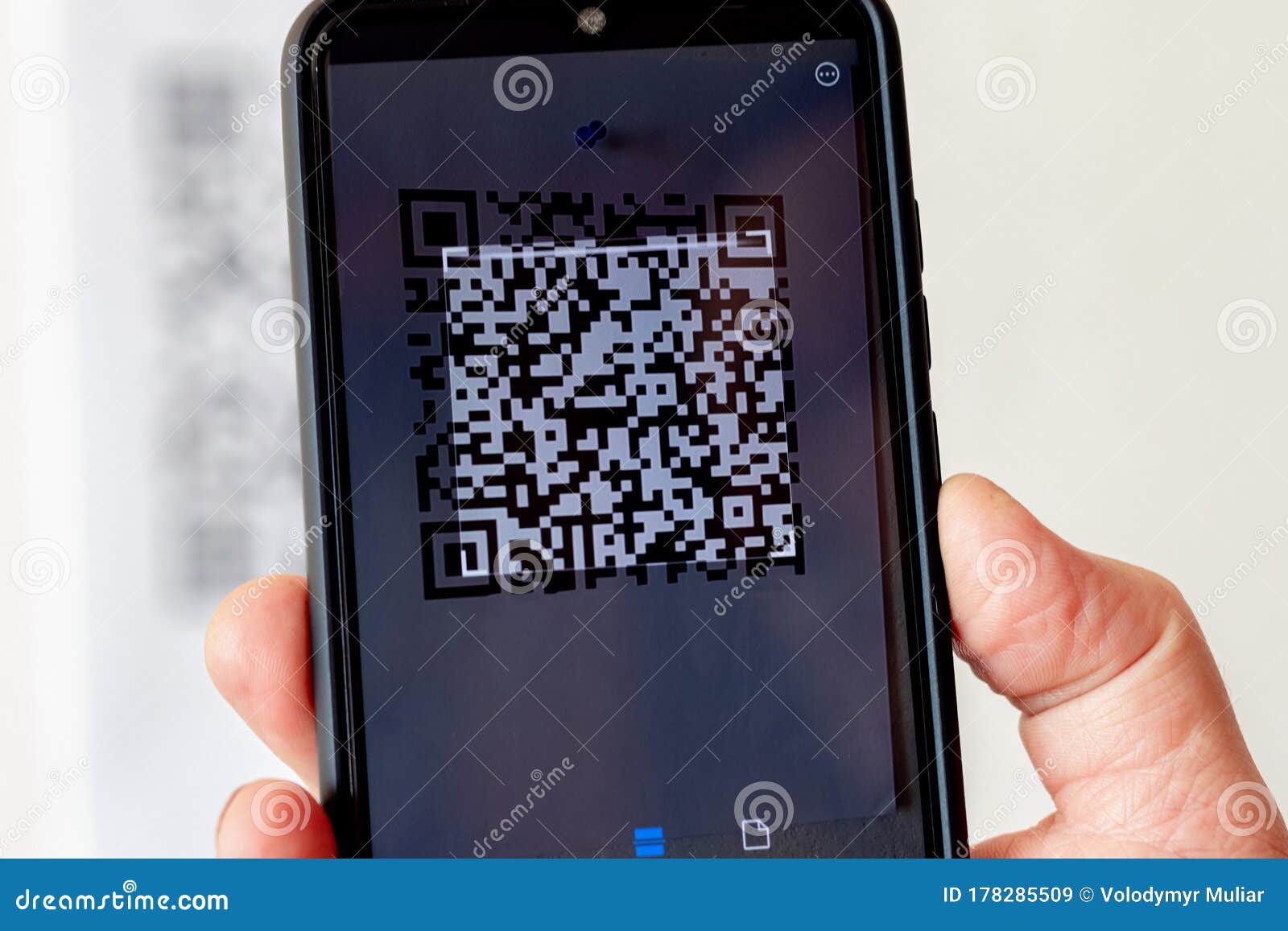 Ukraine, Khmelnitsky, April 20120. a Man with a Phone in His Hand Scans ...