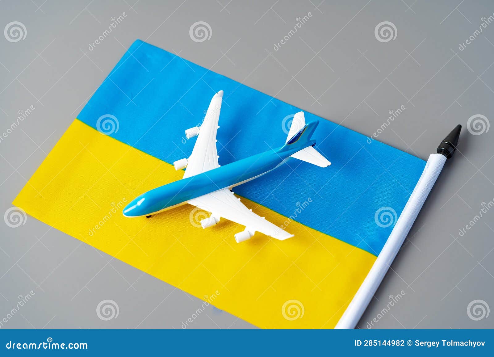 Ukrainian Flag and Toy Plane on Gray Background Close Up Stock Photo ...