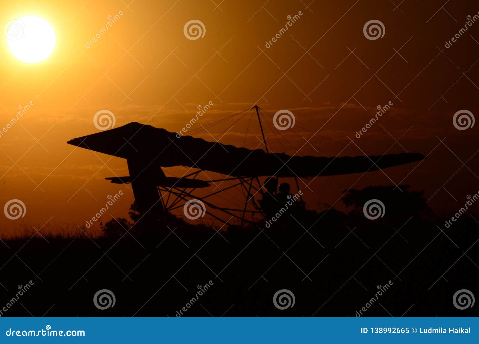Ultralight Airplane at Sunset Stock Image - Image of orange, land ...