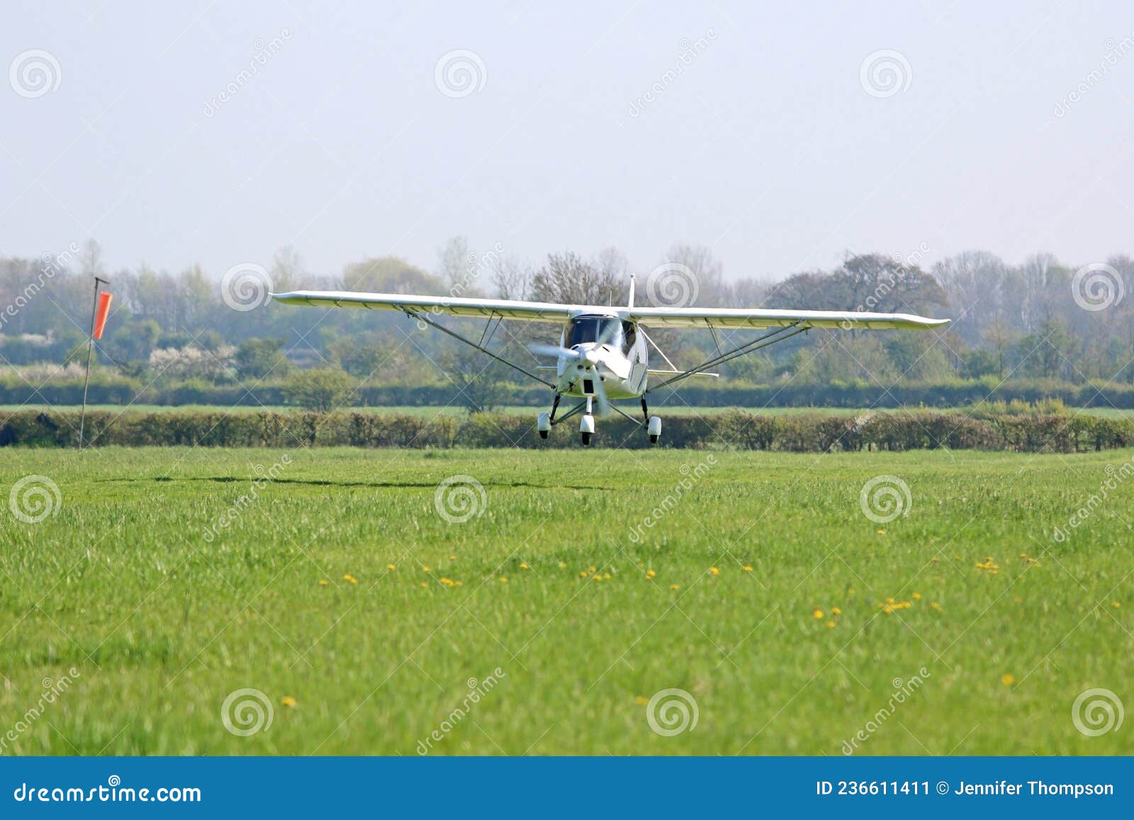 Ultralight Airplane Taking Off from a Grass Strip Stock Image - Image ...