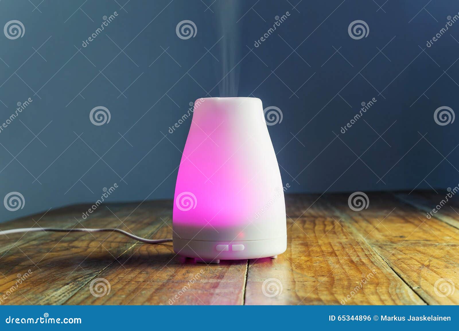 Ultrasonic Essential Oil Diffuser with Purple Light Stock Photo - Image ...