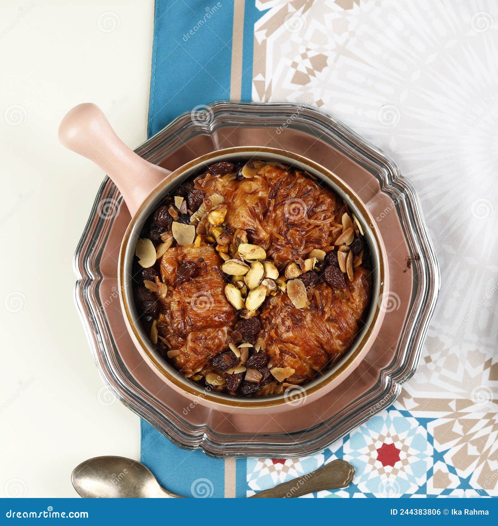 Um Ali Dessert with Chopped Nuts and Raisins. Egyptian Bread Pudding on ...