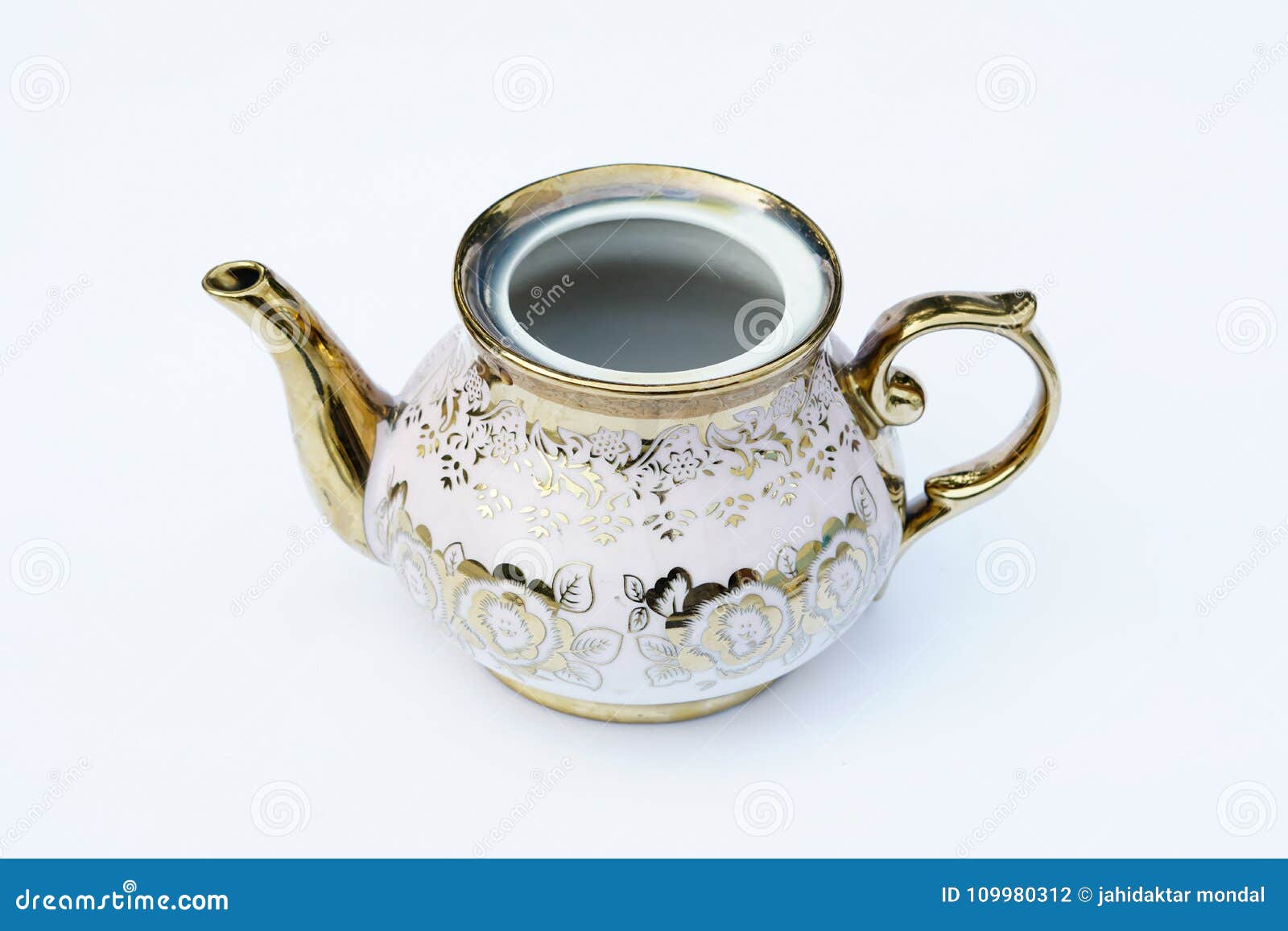 Uma Placa E Uma Chaleira Projetada Dourada Aberta Foto de Stock ...