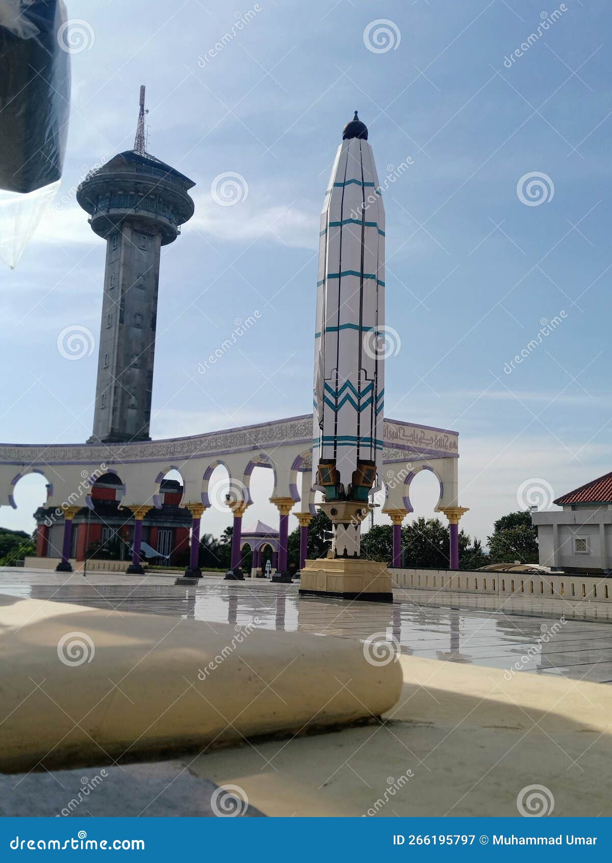 Umbrella with an Automatic System Against the Backdrop of the Minaret ...