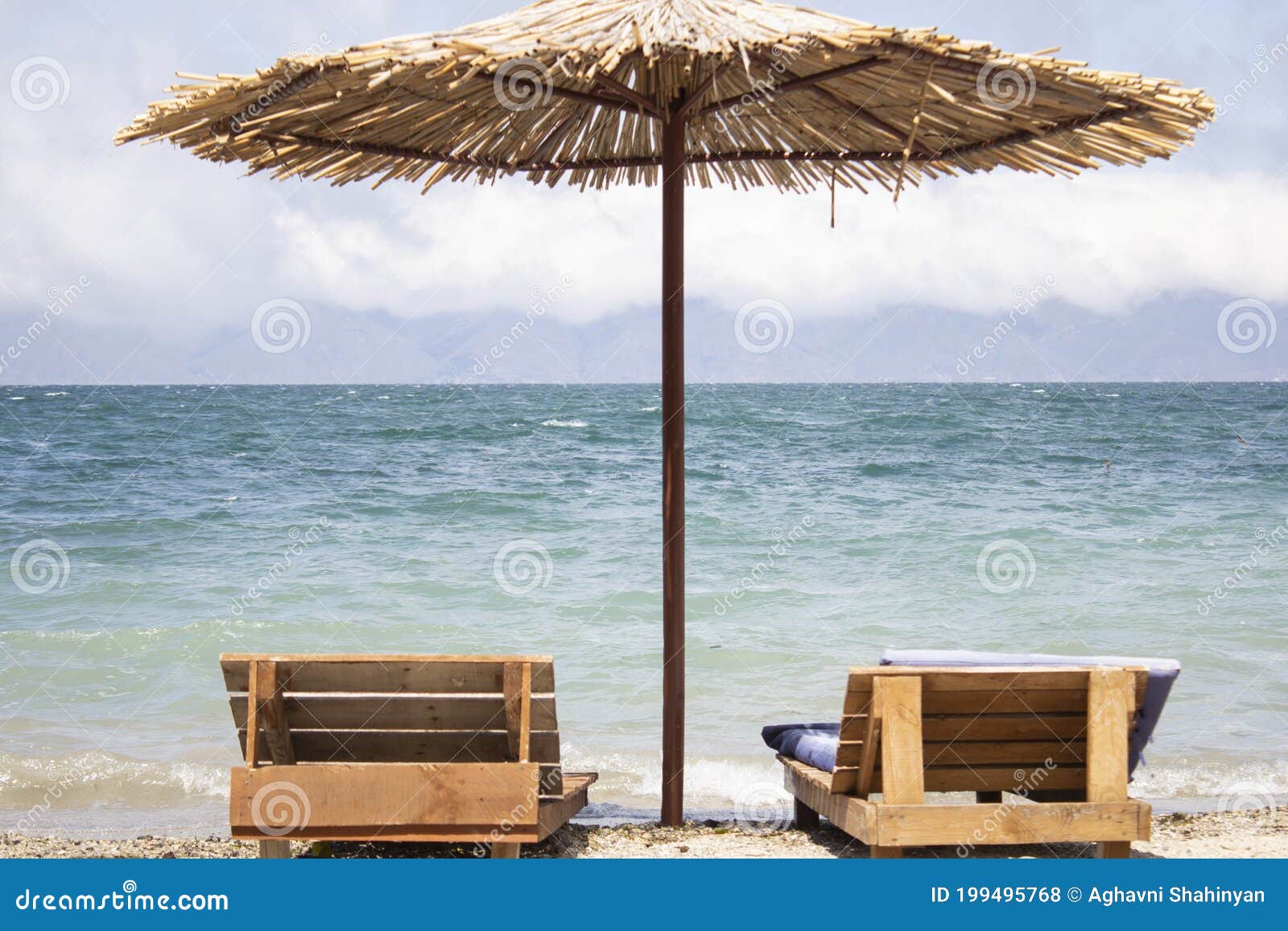 Umbrella and Benches on the Beach Stock Photo - Image of bench, ocean ...