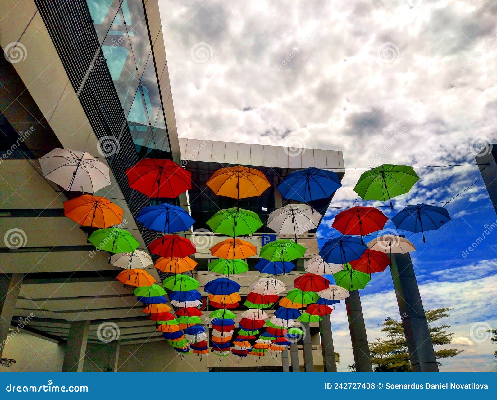Umbrella at the buildings stock photo. Image of umbrella - 242727408