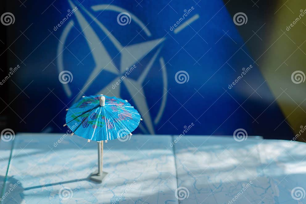 Umbrella Small on the Background of the Map and the Flag of NATO Stock ...