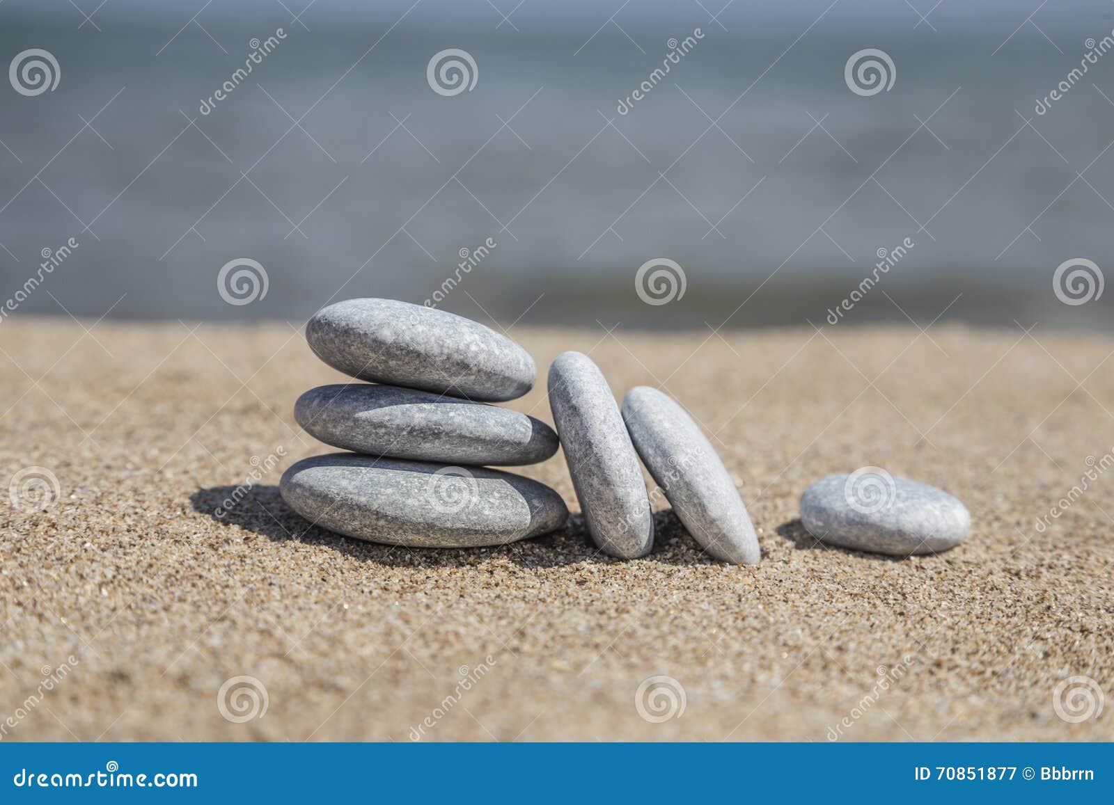 Unbalanced stones on beach stock image. Image of background - 70851877