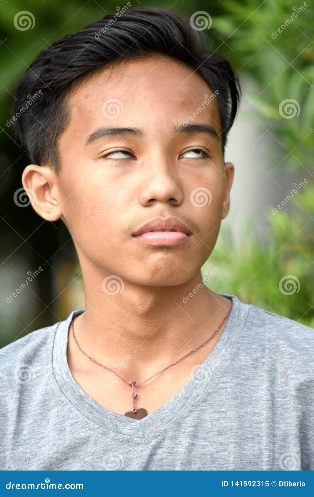 An Uncaring Asian Boy stock image. Image of male, apathy - 141592315