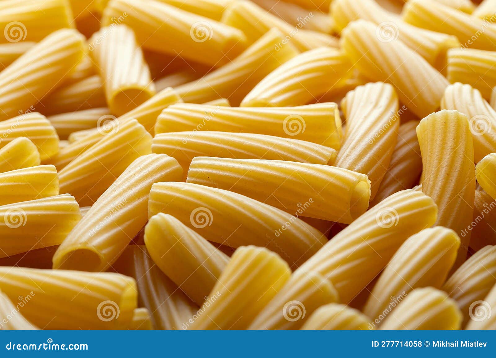 Uncooked Authentic Italian Rigatoni Pasta Background, Close-up. Stock ...