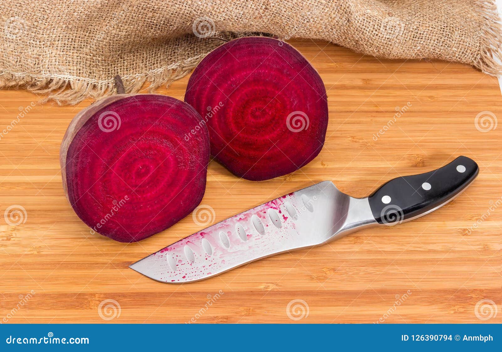 Uncooked Beetroot Cut in Half and Knife on Cutting Board Stock Photo ...