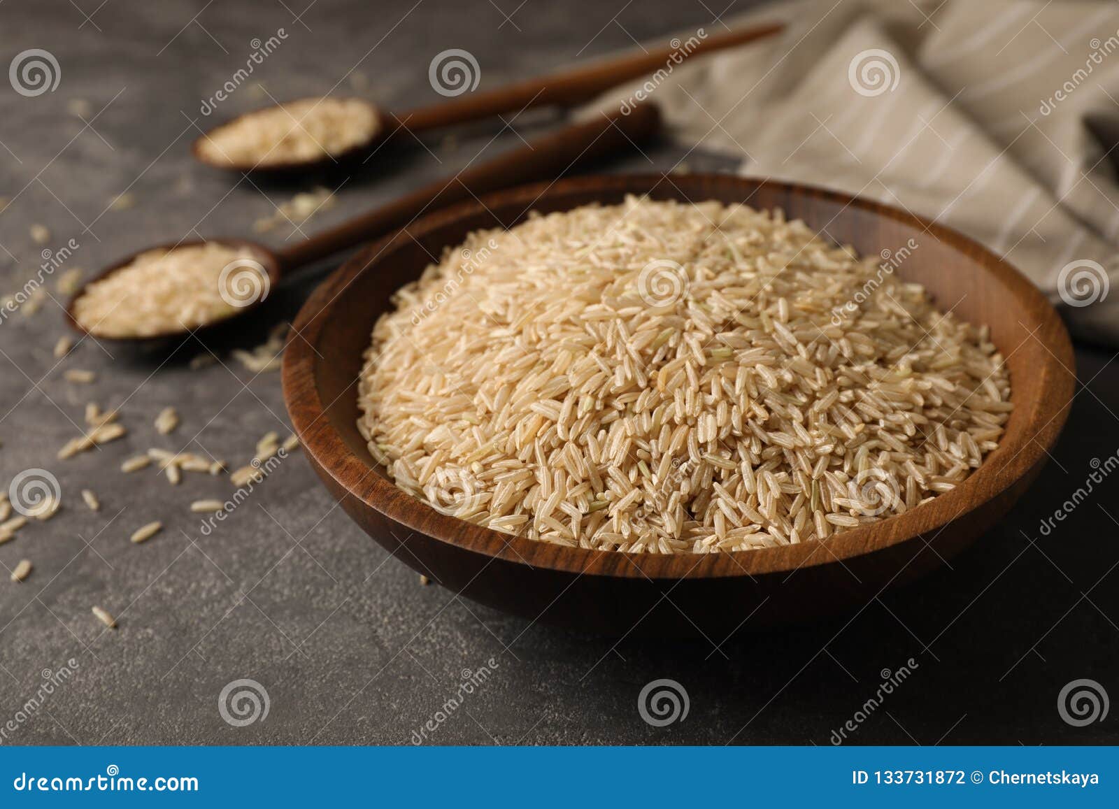 Uncooked Brown Rice in Bowl Stock Photo - Image of seed, brown: 133731872