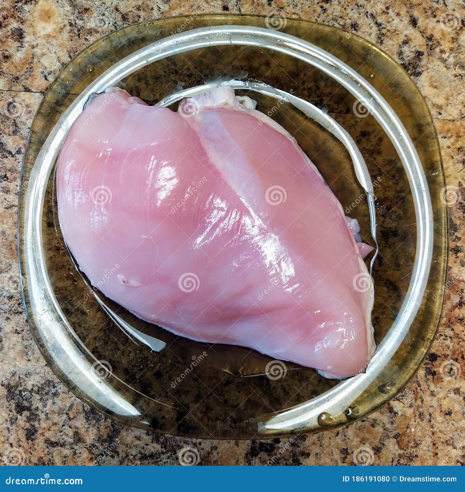 Uncooked Chicken Meat on Plate on Kitchen Table Stock Photo - Image of ...