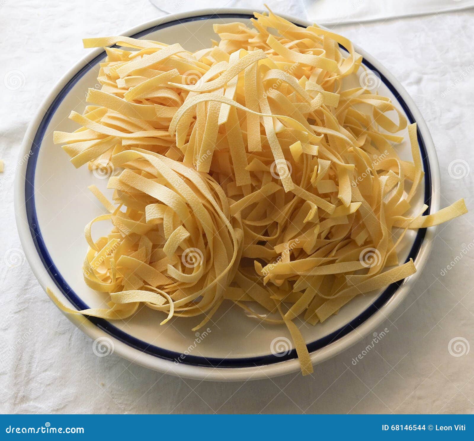Uncooked Dry Tagliatelle Pasta Stock Photo - Image of nest, single ...