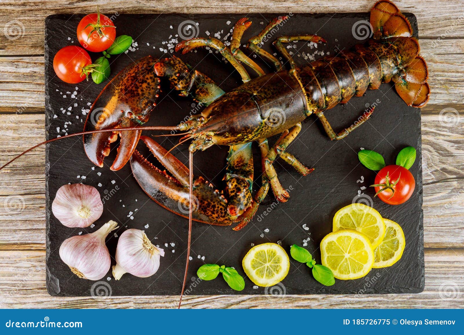 Uncooked Fresh Lobster on Black Board with Spices and Vegetables Stock ...