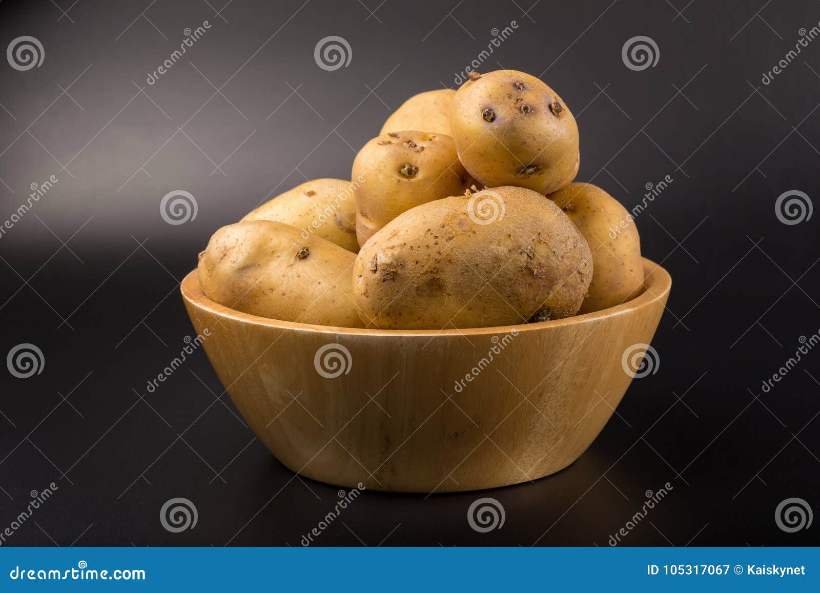 Uncooked Fresh Potatoes Isolated on a Black Background Stock Image ...
