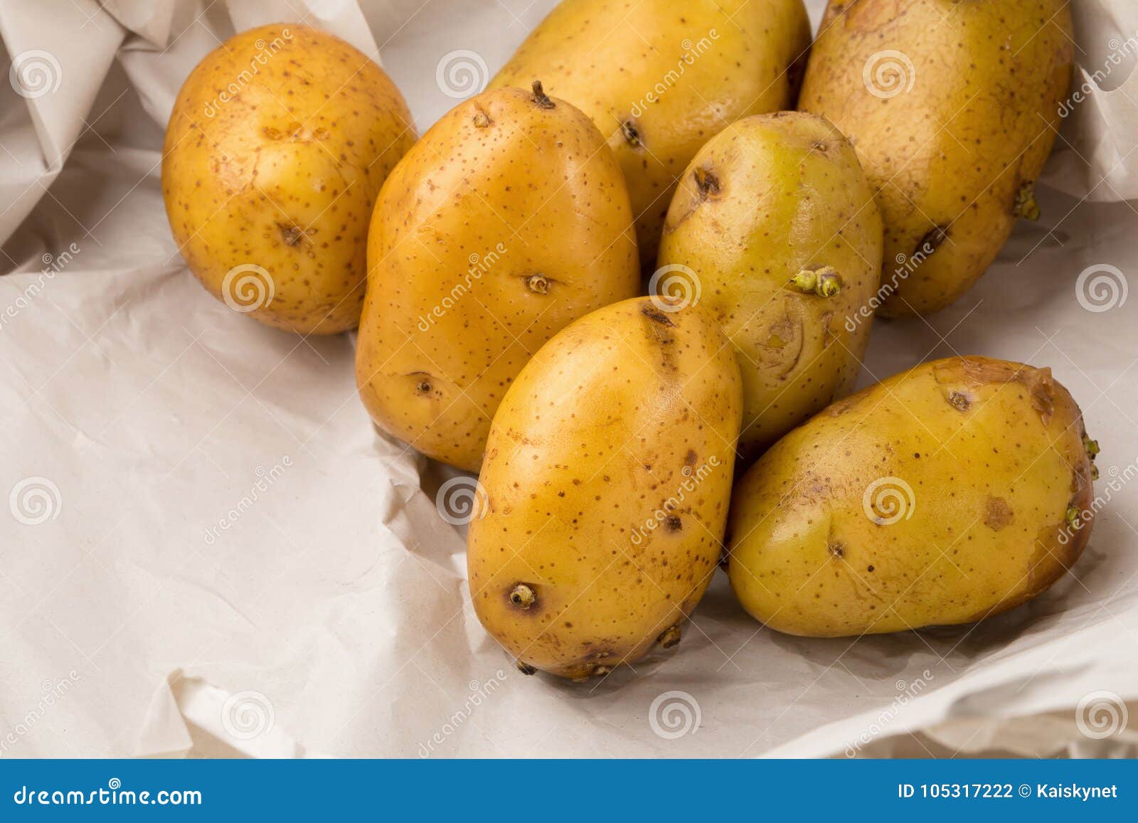 Uncooked Fresh Potatoes Isolated on a Black Background Stock Photo ...