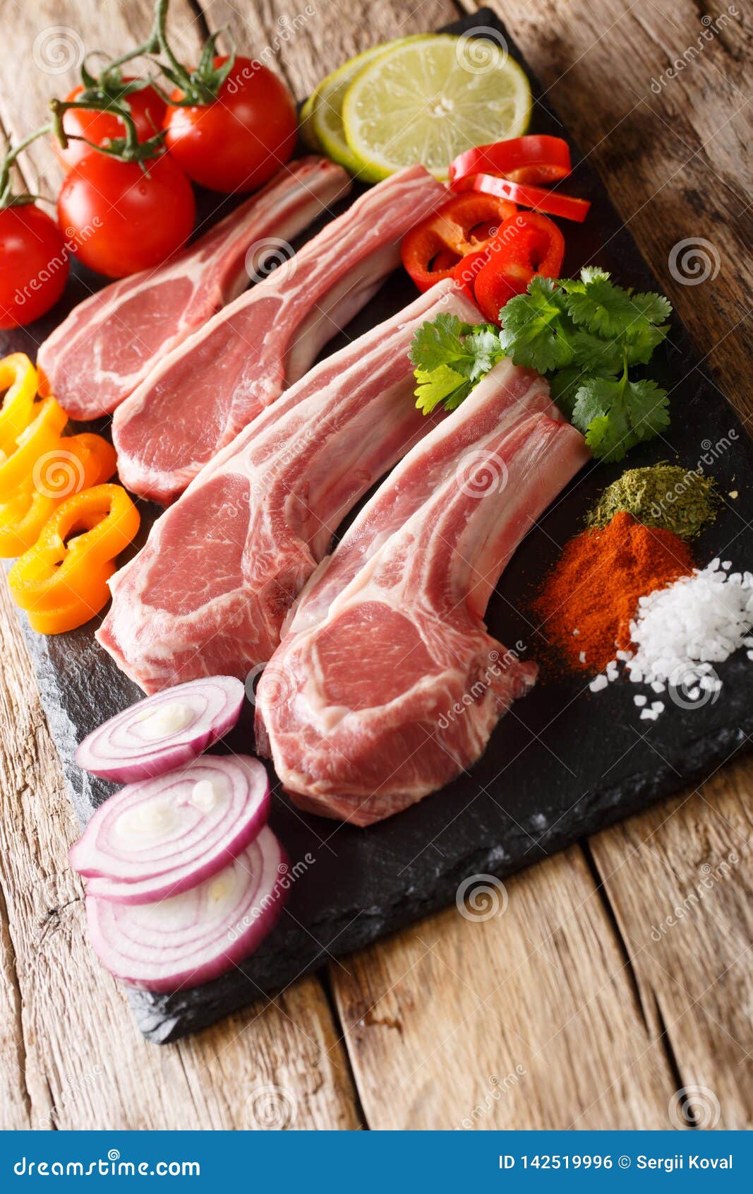 Uncooked Lamb Chops with Fresh Vegetable Ingredients and Spices Close ...