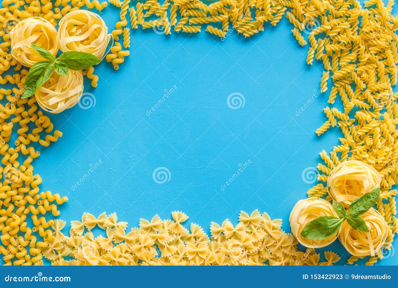 Uncooked Pasta Frame for Italian Food on Blue Table Background Top View ...