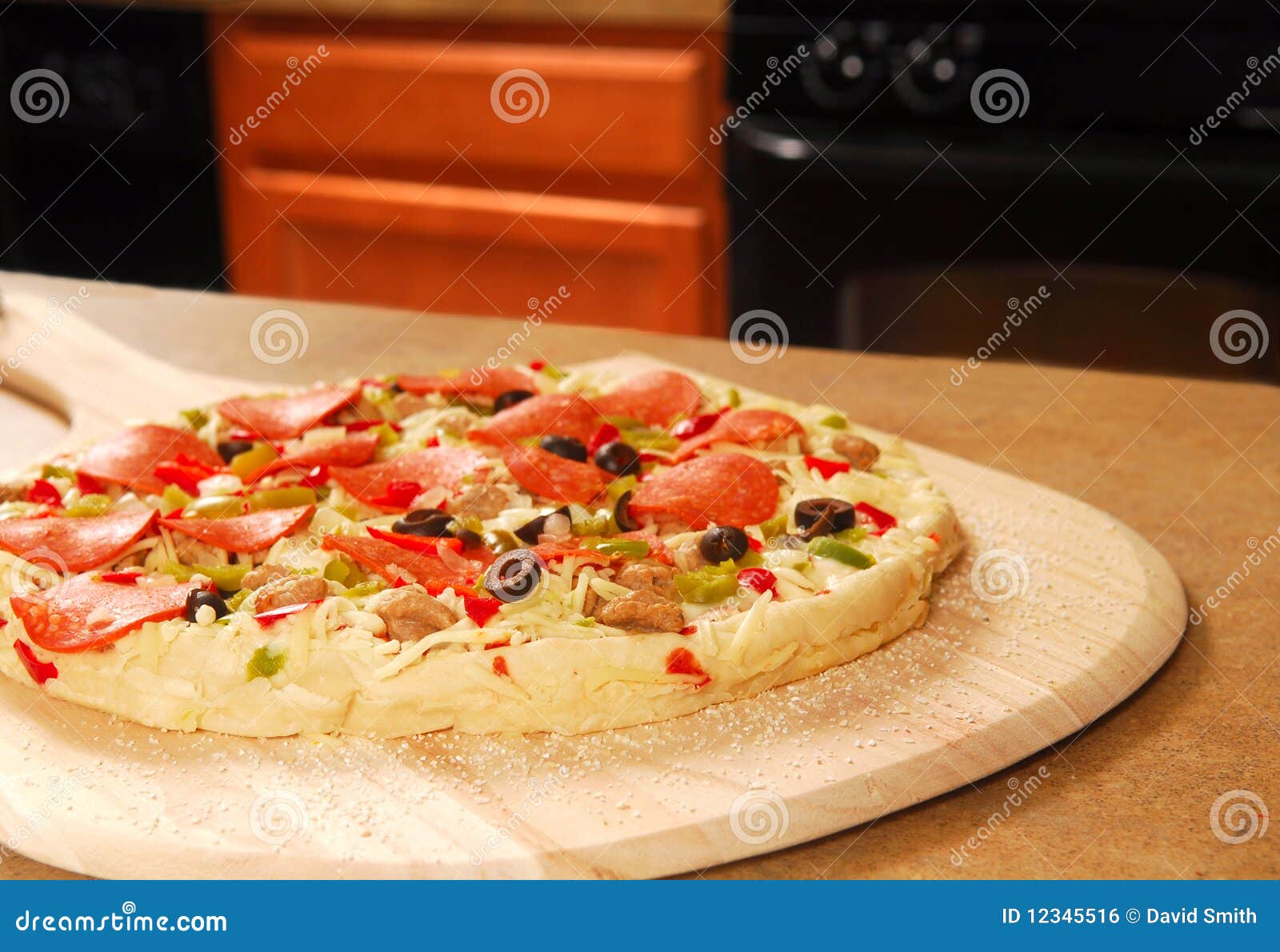 Uncooked pizza on peel stock photo. Image of bell, cheese - 12345516