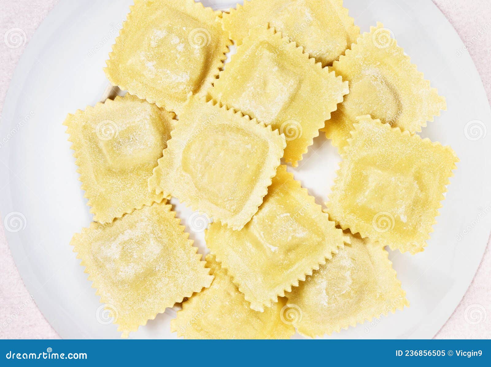 Uncooked ravioli on plate stock image. Image of food - 236856505