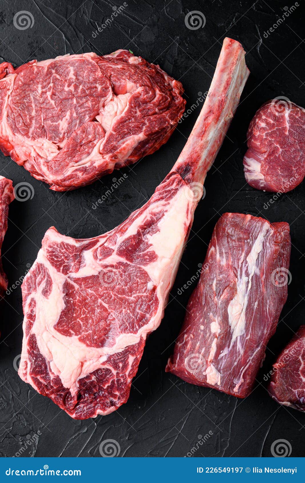 Uncooked Raw Beef Red Meat Marbled with Bone in, on Black Stone ...