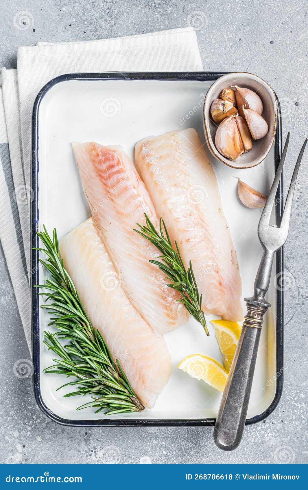 Uncooked Raw Cod Loin Fillet Steaks with Herbs in Kitchen Tray. Gray ...
