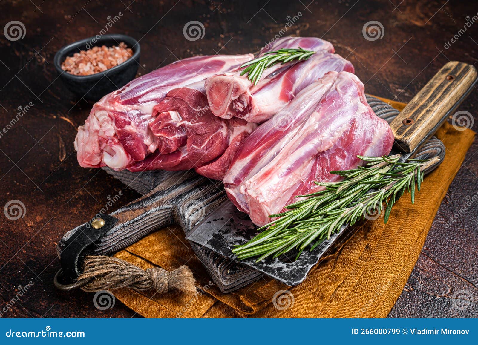 Uncooked Raw Lamb Mutton Shanks on a Butcher Board. Dark Background ...