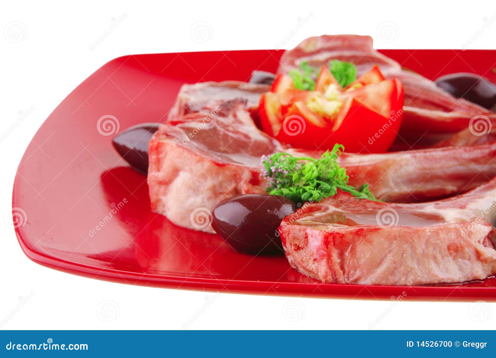Uncooked ribs on red plate stock photo. Image of object - 14526700