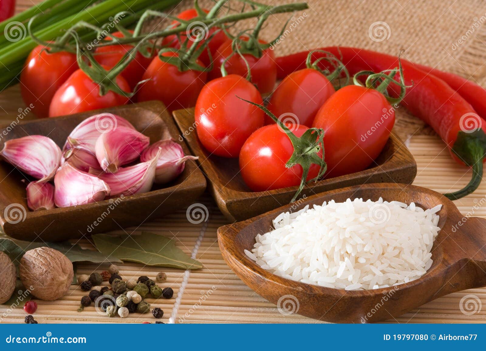 Uncooked rice in bowl stock photo. Image of garlic, food - 19797080