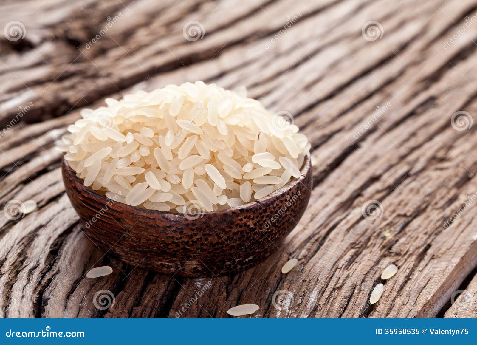 Uncooked rice in a bowl stock image. Image of rough, dark - 35950535
