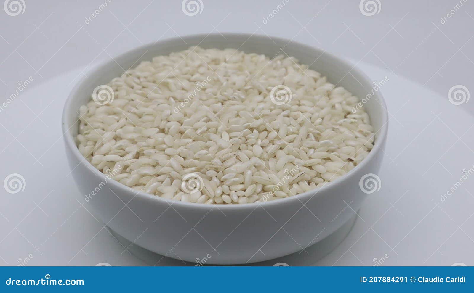 Uncooked Rice in a Bowl on Rotating Display. Stock Video - Video of ...