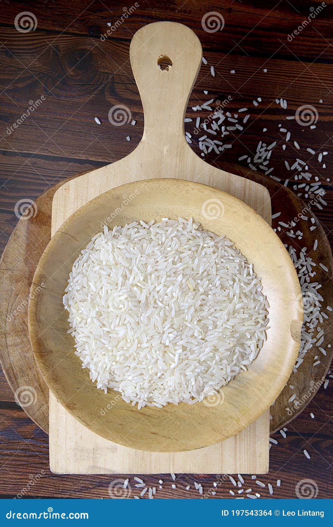 Uncooked rice in a bowl stock photo. Image of textured - 197543364