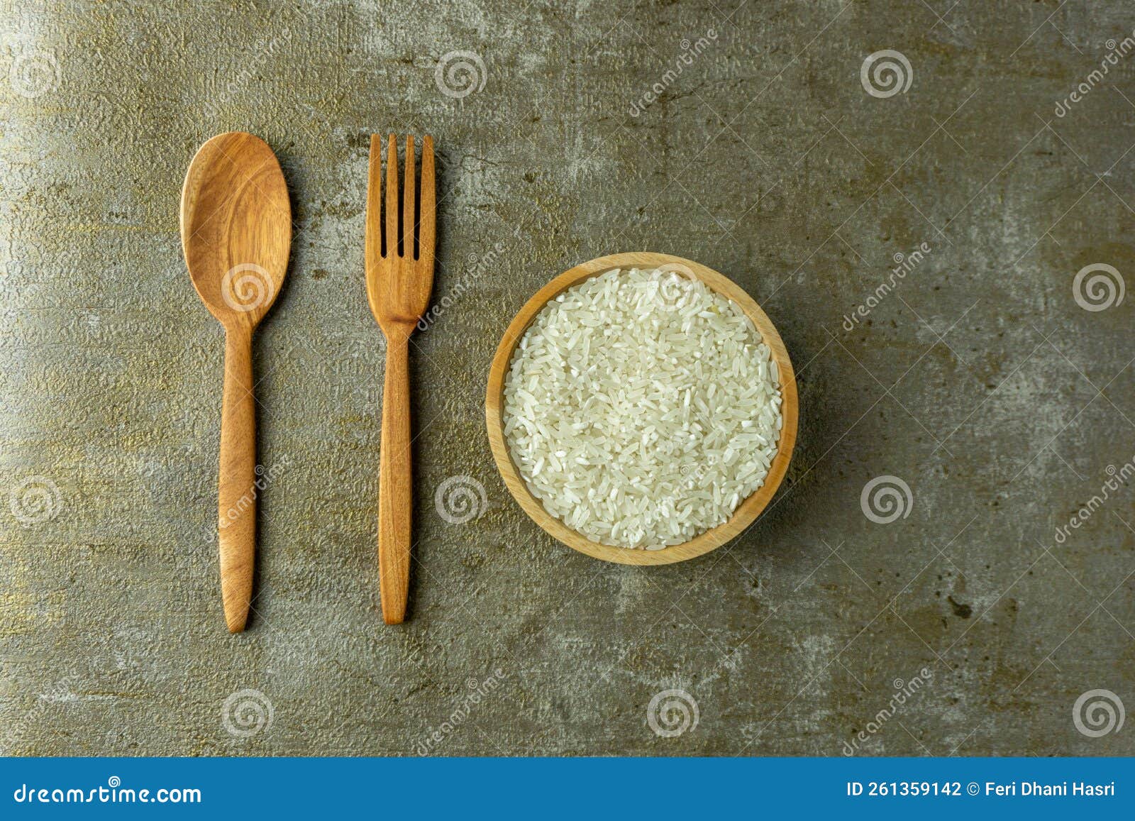 Uncooked Rice or Dry Rice. Raw Rice in Wooden Bowl with Wooden Spoon ...