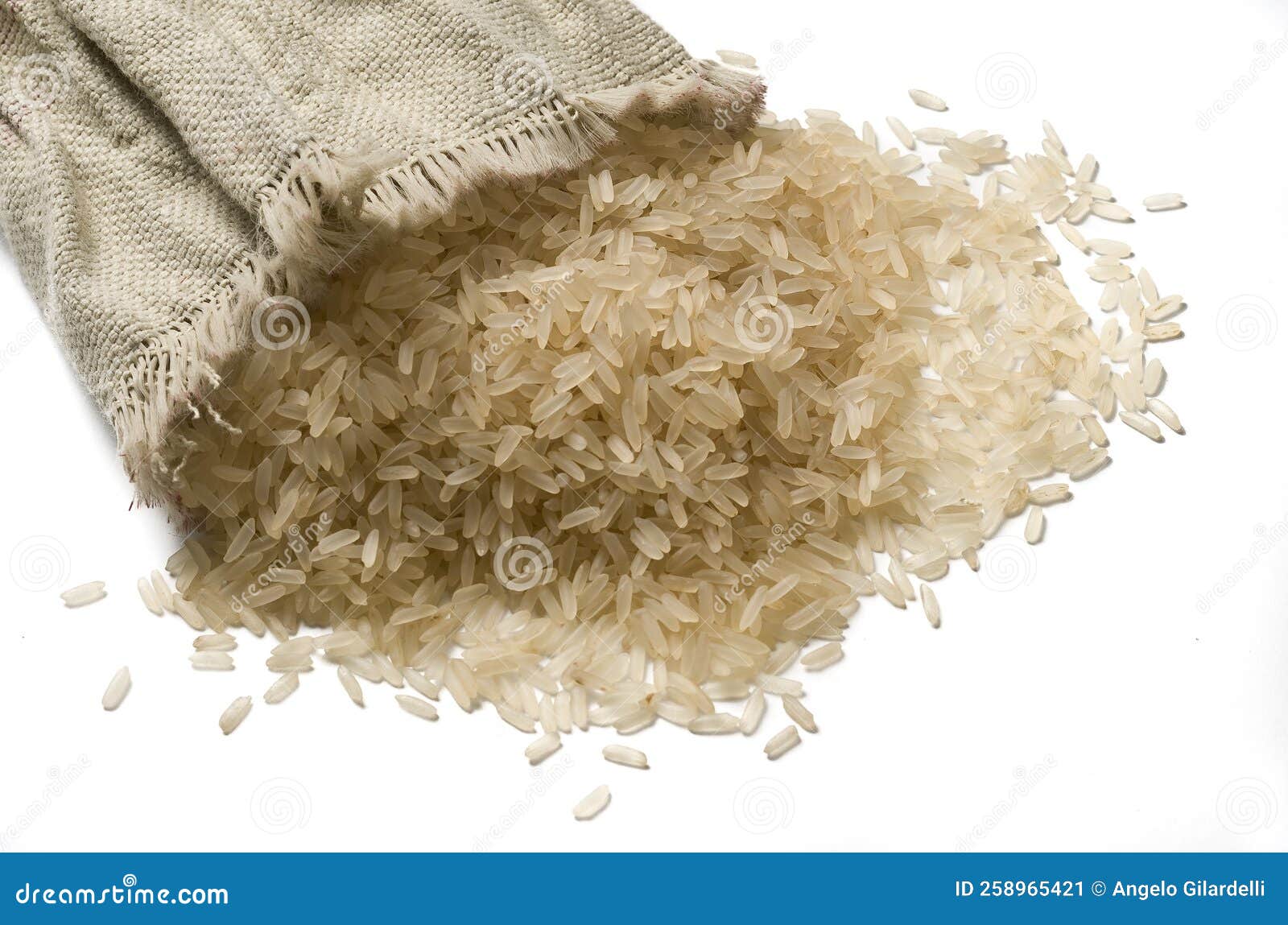 Uncooked Rice Grains Spilled on the Table from a Burlap Sack Stock ...